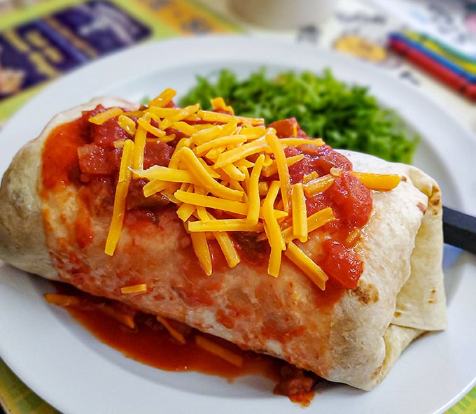 This breakfast burrito isn't just wrapped—it's hugging its fillings with tortilla love while that cheese melts like your resistance.
