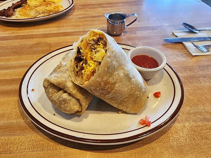 A breakfast burrito so perfectly wrapped it could teach a class on how to properly tuck in bedsheets, with just the right salsa-to-filling ratio.