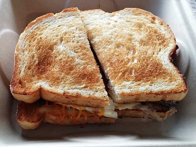 This golden-grilled breakfast sandwich isn't just a meal, it's architectural perfection—layers of melty goodness between perfectly toasted bread.