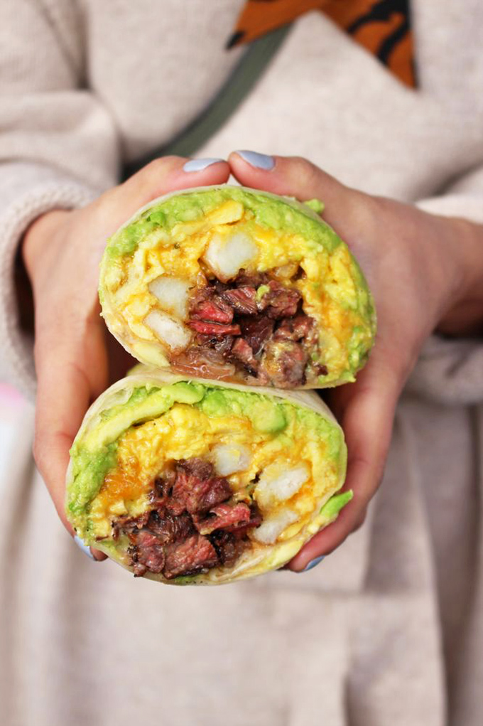Not your abuela's breakfast burrito—this colorful creation wraps steak, eggs, and avocado in a vibrant green tortilla that's as photogenic as it is delicious.