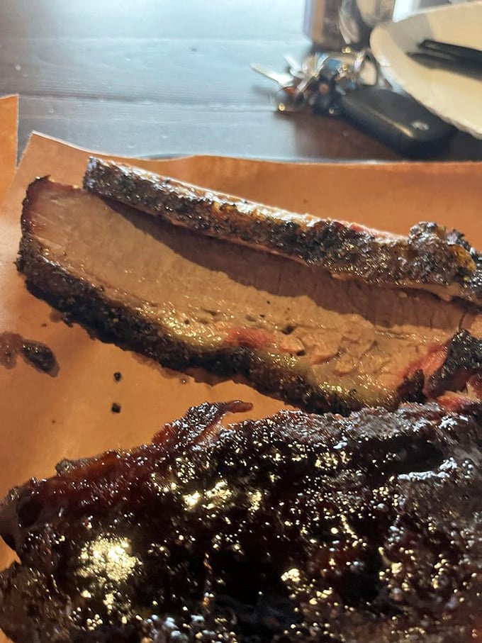 Brisket with a smoke ring so perfect it could be framed in an art gallery—this is meat that's achieved time-stopping tenderness.
