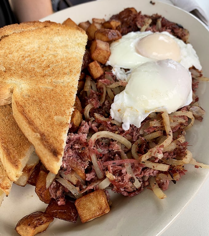 This corned beef hash with those perfectly runny eggs isn't just breakfast—it's edible therapy that costs less than a session with your therapist.