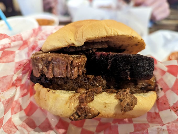 A brisket sandwich that doesn't need fancy garnishes—just meat that's spent more time perfecting itself than most of us spend at the gym.