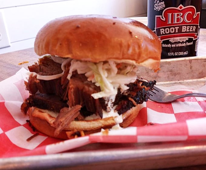 The brisket sandwich—where pillowy bun meets smoky meat in a romance that puts most rom-coms to shame.
