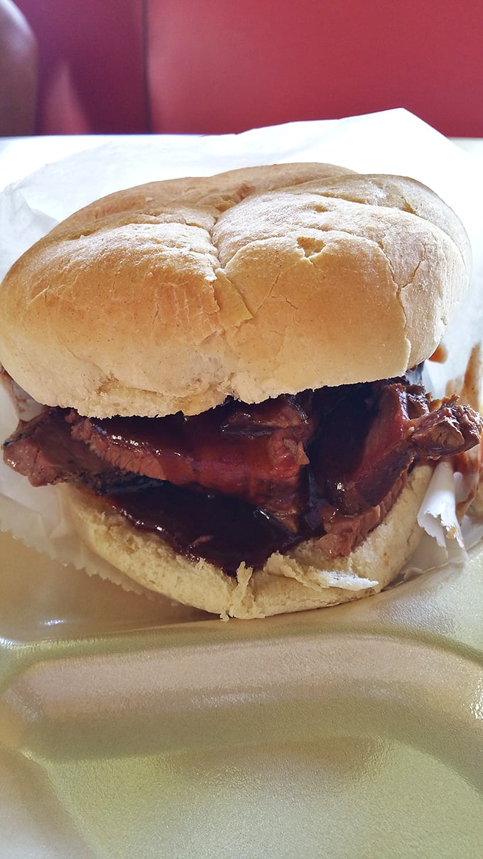 The brisket sandwich doesn't need to show off—it knows exactly how good it is. That bark! That smoke ring!