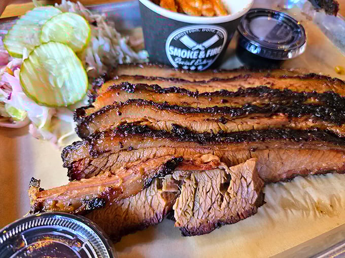 Behold the brisket—that perfect pink smoke ring isn't just for show. It's the barbecue equivalent of a Michelin star.