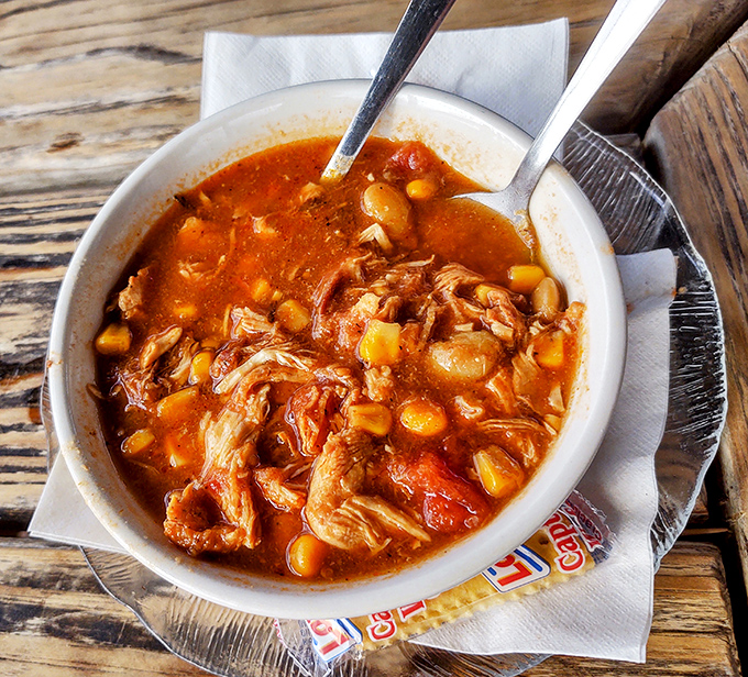 Brunswick stew that would make any Georgian proud – tender meat, sweet corn, and tomato broth that's been simmering since approximately the Carter administration.