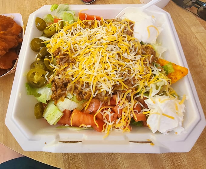 This taco salad isn't messing around—a mountain of cheese, seasoned beef, and fresh veggies that makes healthy eating feel like cheating.