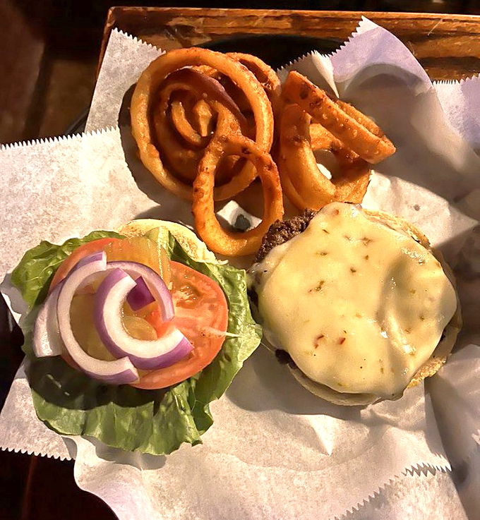 A burger that doesn't need Instagram filters—just honest ingredients stacked high enough to require jaw exercises before attempting the first bite.