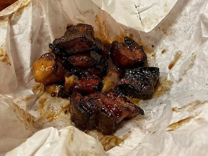 Burnt pork belly chunks glisten with rendered fat, each bite a carnivore's reward for making the pilgrimage to Lockhart.