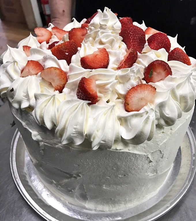 This strawberry-crowned cake isn't just dessert – it's what birthday wishes look like when they take physical form.
