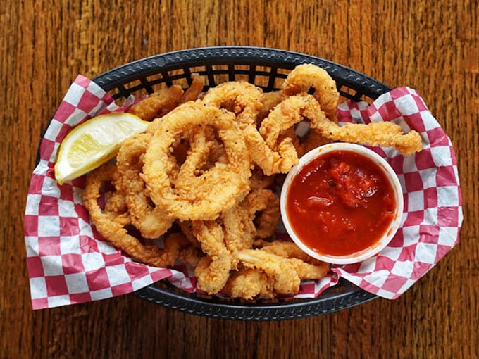 These calamari rings aren't playing hard to get—tender, crispy, and ready for a dip in that vibrant marinara. Ocean-to-table perfection.