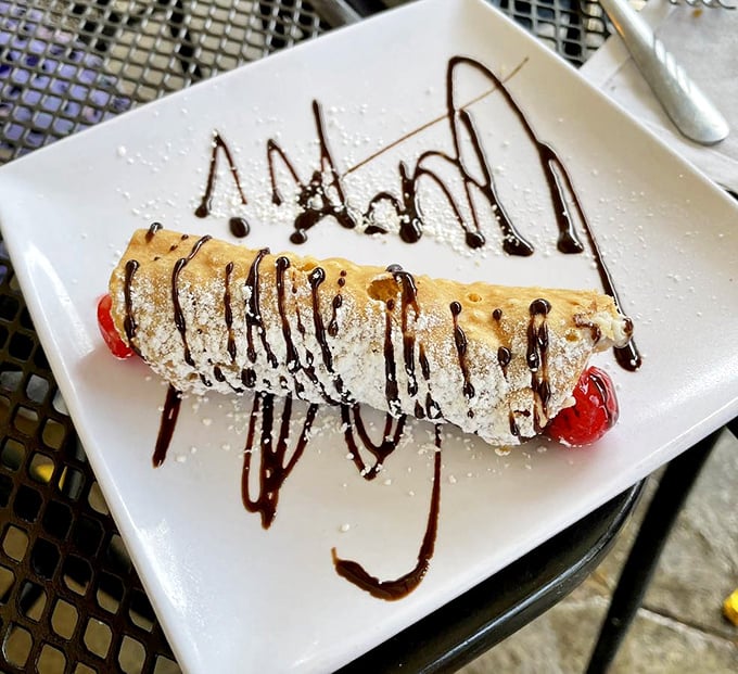 Sweet endings don't get more classic than this cannoli—crisp shell, creamy filling, and chocolate drizzle creating the dessert equivalent of a standing ovation.