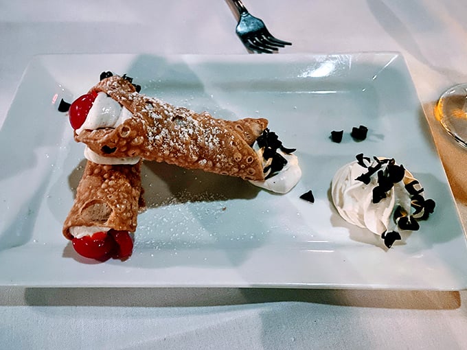 Cannoli so authentic they should come with their own passport—crisp shells, sweet ricotta filling, and those cherries adding a pop of color and flavor.