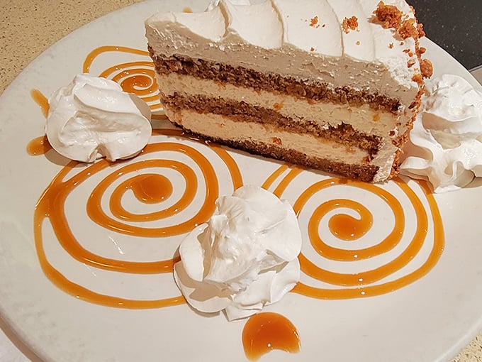 This isn't just dessert—it's edible art. Layers of cake and cream with caramel swirls that would make Jackson Pollock jealous.