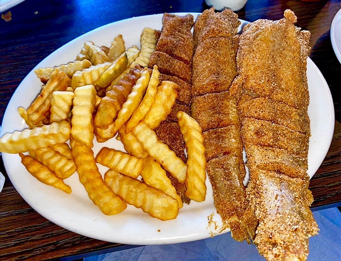Crispy catfish fillets with crinkle-cut fries—proof that sometimes the simplest combinations make for the most memorable meals.