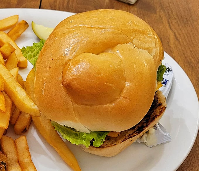 A burger that doesn't need fancy toppings or a clever name—just honest ingredients stacked on a bun that's clearly been baked with love.