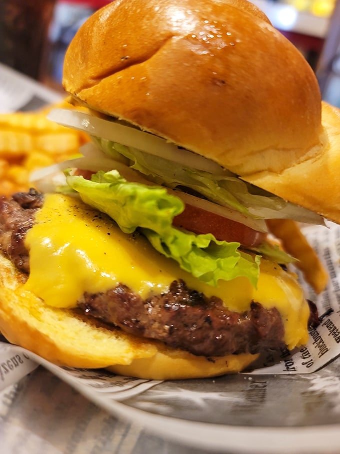 Behold, the cheeseburger of your dreams—where the cheese cascades down the patty like a yellow waterfall of happiness.
