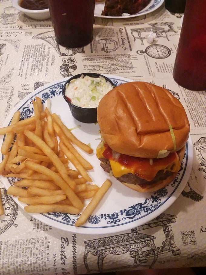 This isn't just a cheeseburger—it's architecture. A towering testament to the art of stacking deliciousness between two buns. Napkins required, no regrets allowed.