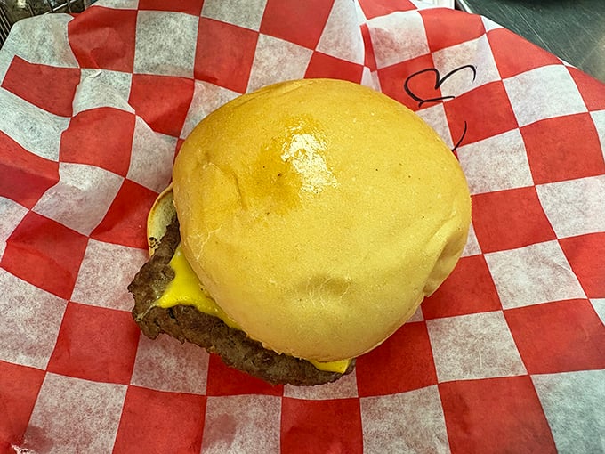 Simplicity perfected: a classic cheeseburger on a soft bun. No tweezers or microgreens required—just honest-to-goodness deliciousness.
