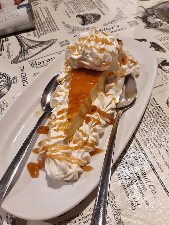 Cheesecake elevated to art form. That caramel drizzle isn't just decoration—it's the finishing touch on a masterpiece of dessert engineering.