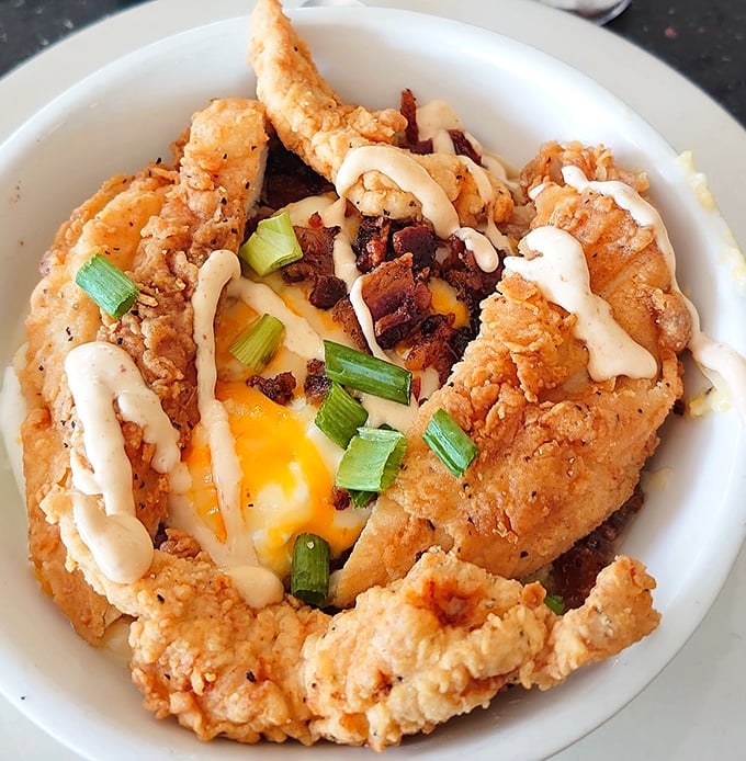 This isn't just chicken and grits—it's a Southern symphony of crispy, creamy, and cheesy that makes you want to stand up and applaud.