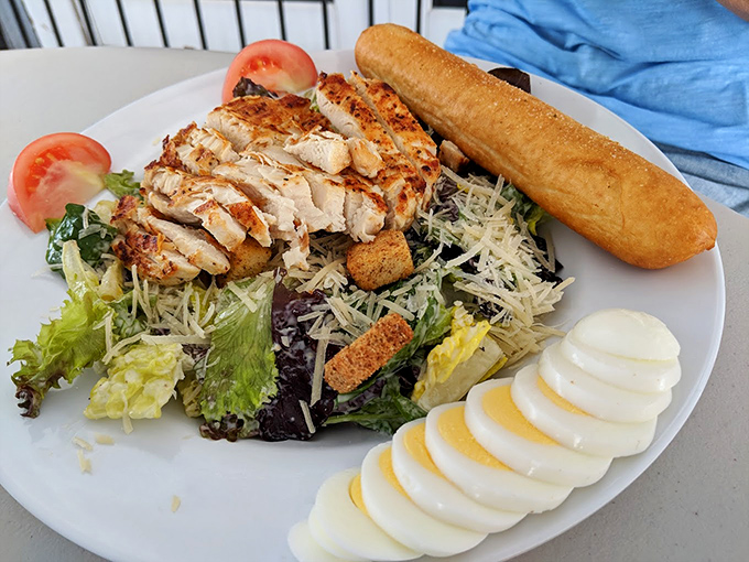 A Caesar salad that Julius himself would approve of—grilled chicken perfectly positioned like it's posing for its Instagram debut.