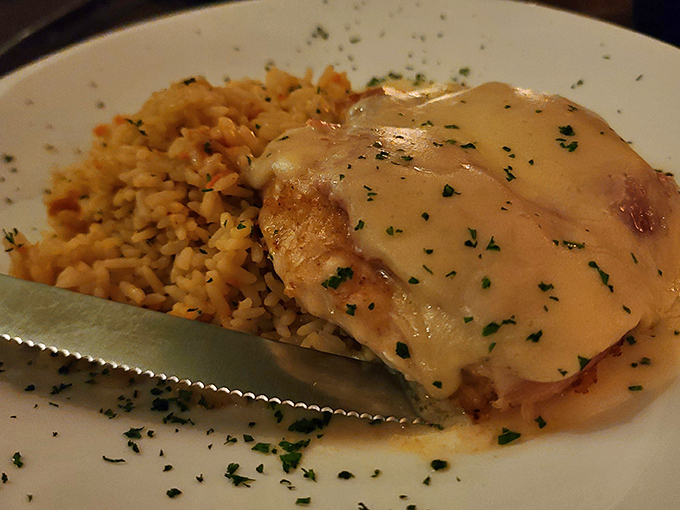 Chicken Cordon Bleu with its melty cheese waterfall and rice pilaf sidekick—comfort food that graduated from culinary finishing school.