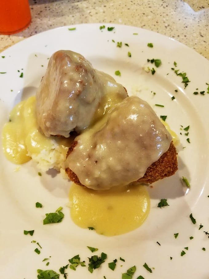 Chicken croquettes bathed in golden gravy—comfort food that whispers, "Everything's going to be okay" with every heavenly bite.