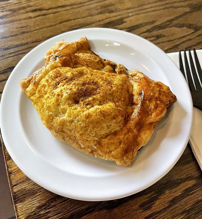 This golden pastry pocket doesn't just contain a meal—it holds centuries of British culinary wisdom in one hand-held package.