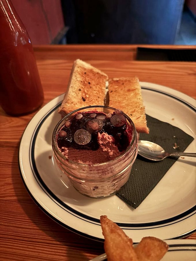 Chicken liver pâté dressed up with berries, proving that even humble ingredients deserve their red-carpet moment.