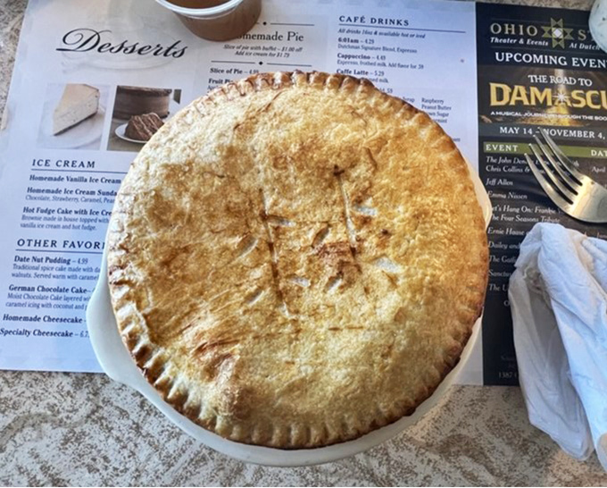 Not just any pot pie – a golden-domed fortress protecting a treasure of tender chicken, vegetables, and gravy worth crossing county lines to experience.