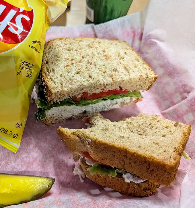 The humble sandwich, elevated to art form—layers of chicken salad, crisp vegetables, and soft bread that would make the Earl of Sandwich weep with pride.