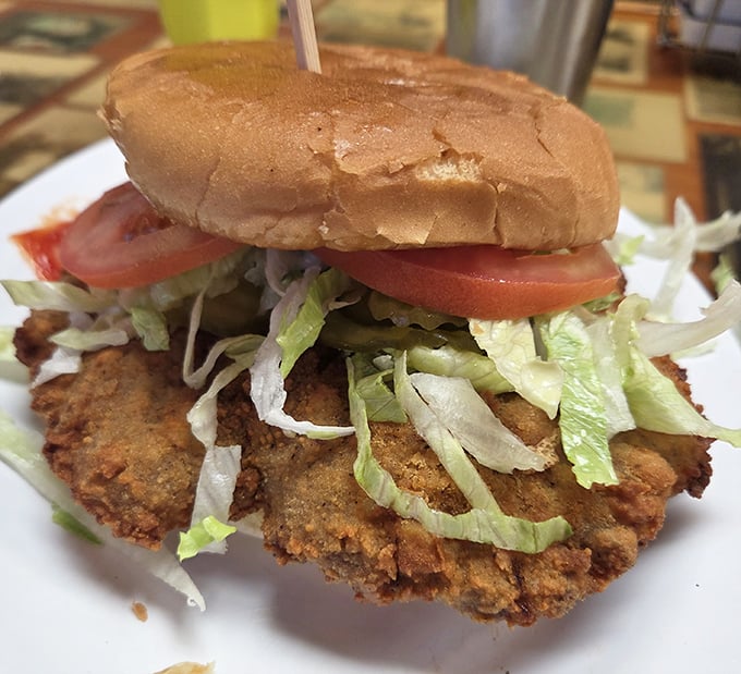 This isn't just a chicken sandwich – it's a crispy, golden monument to comfort food that makes salads everywhere feel inadequate.