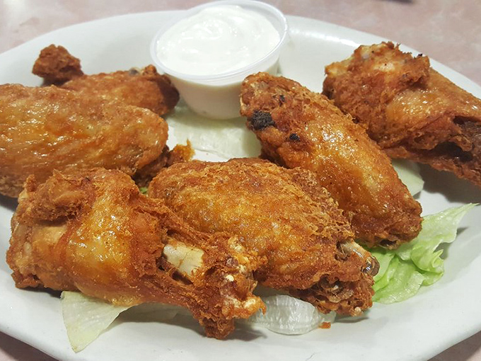 Crispy on the outside, juicy on the inside—these wings aren't trying to reinvent the wheel, just perfect it one crispy bite at a time.