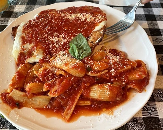 Chicken parm with pasta: the Italian equivalent of a warm hug. That basil leaf isn't garnish—it's the exclamation point on a perfect sentence.