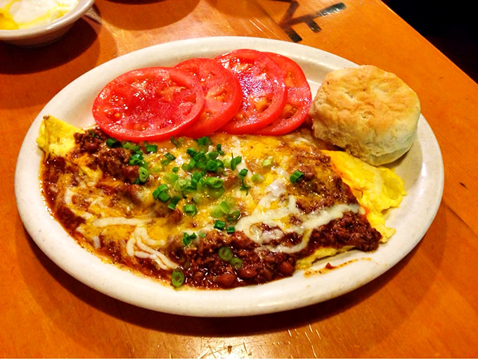 This omelet could double as a blanket, generously stuffed with enough chili to warm your soul.