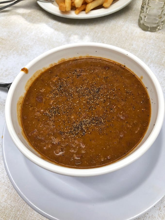Their chili deserves its own zip code – rich, mysterious, and absolutely worth the napkin casualties.