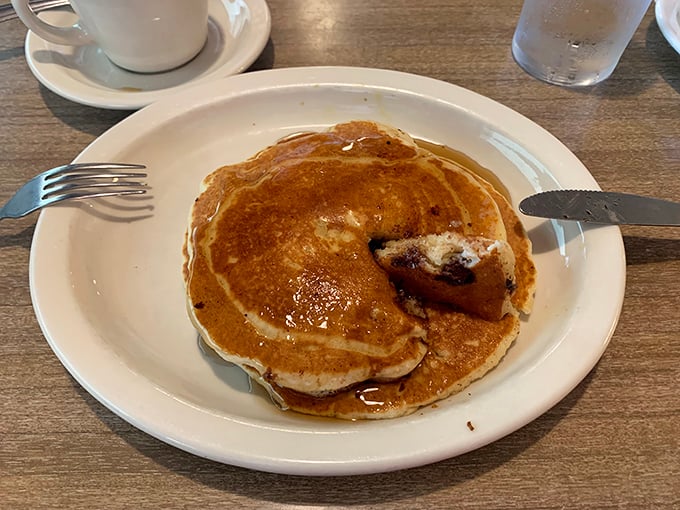 Pancakes so fluffy they could double as pillows, with chocolate chips melting into little pools of happiness. Breakfast of champions—and everyone else.