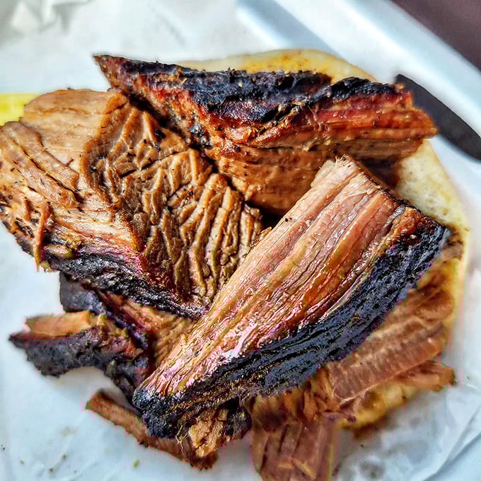 Brisket with the perfect bark-to-meat ratio—each slice a testament to patience, smoke, and the magic that happens when you refuse to rush perfection.