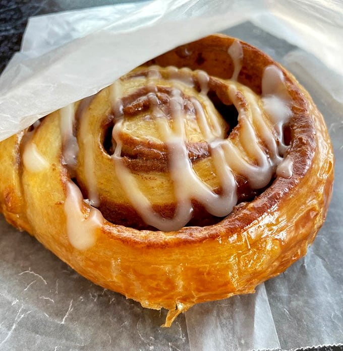 Golden, flaky, and glistening with icing – this cinnamon roll isn't just breakfast, it's a legitimate reason to get out of bed.