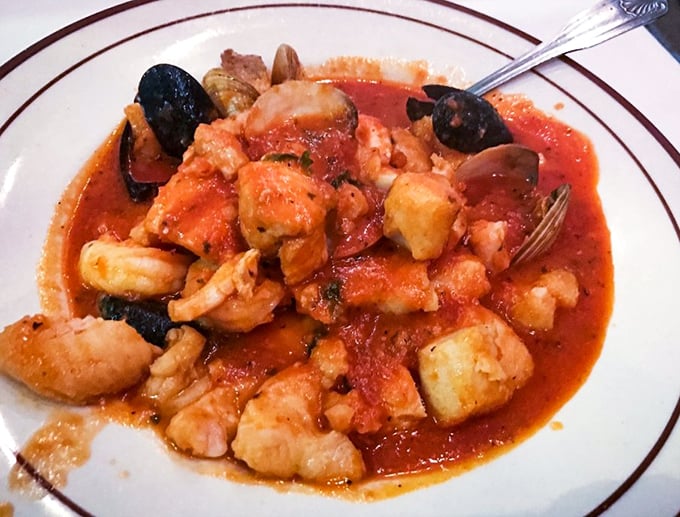 Cioppino so authentic you'll check your passport—a tomato-based seafood symphony where each bite delivers the essence of coastal Italian cooking.