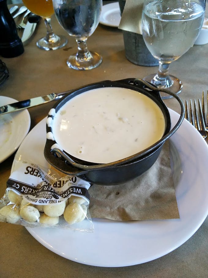 New England clam chowder served in cast iron with oyster crackers—seafood comfort in a bowl that would make your Massachusetts ancestors proud.