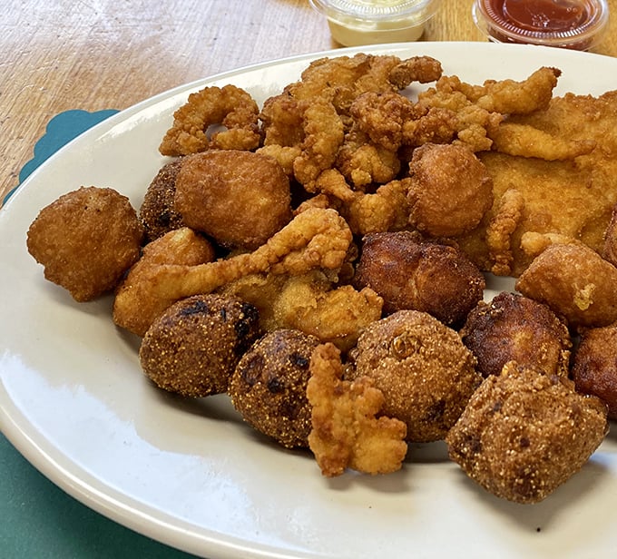 A seafood sampler that speaks volumes—golden-fried treasures from the deep that make sharing both necessary and nearly impossible.