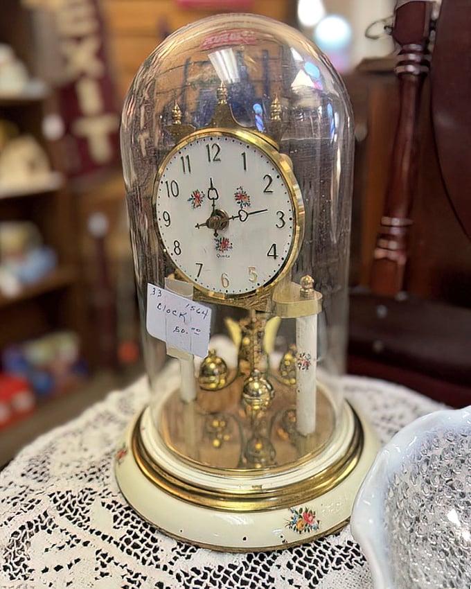 This delicate anniversary clock under glass doesn't just tell time—it preserves it, each tick a heartbeat connecting past to present.
