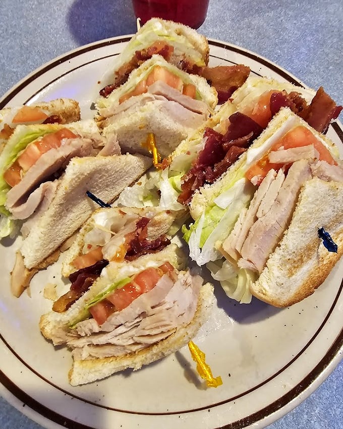 The club sandwich – that architectural marvel of turkey, bacon, and veggies that makes lunch feel like a celebration.