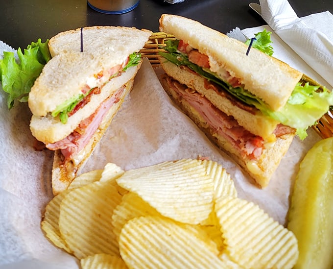 The club sandwich—architecture you can eat. Those perfectly stacked layers deserve their own blueprint in the sandwich hall of fame.