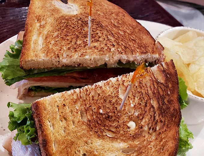 A club sandwich that makes country clubs jealous—layers of smoked goodness that redefine the lunch classic.