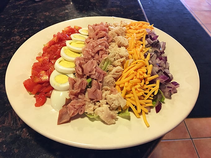 A Cobb salad arranged with military precision—each ingredient standing at delicious attention. The lunch equivalent of a color guard.