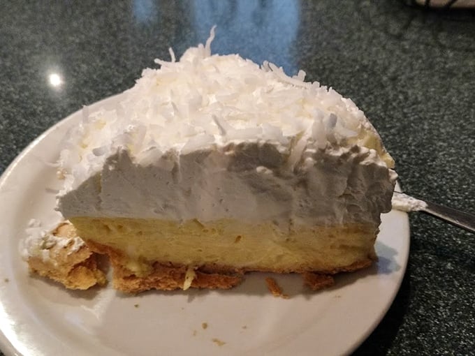 Coconut cream pie that would make your grandmother both jealous and proud—a cloud of whipped cream atop sunshine-yellow filling.